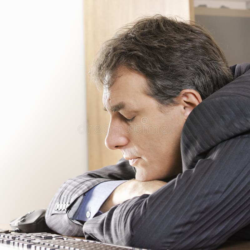 Man sleeping on workplace stock photo. Image of tired - 25391446