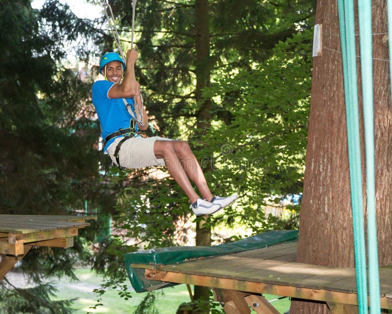 Man Slides Ropeway High Rope Course Stock Photos - Free & Royalty-Free ...