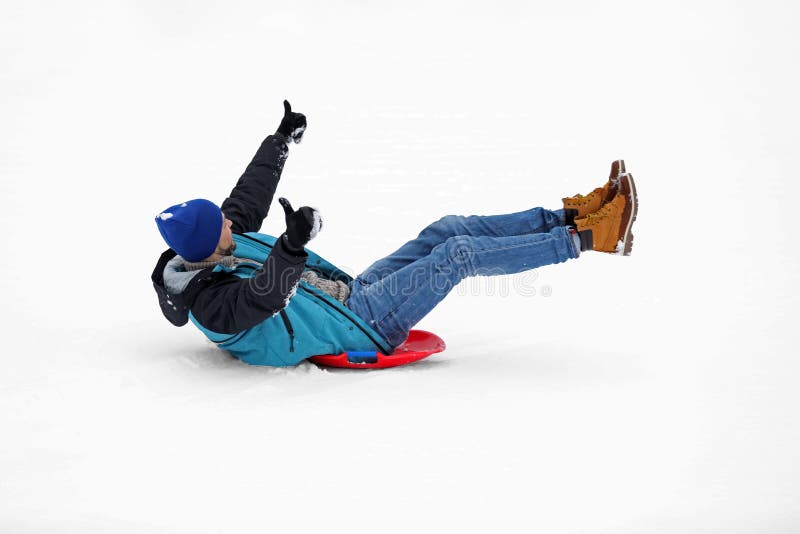 Man Sliding on Sled Outdoors. Winter Stock Photo - Image of leisure ...