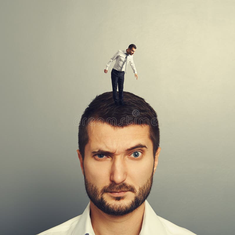 Man with Small Man on the Head Stock Photo - Image of doubt, idea: 36773232