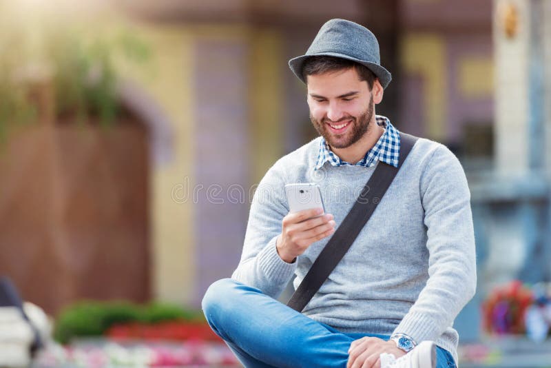 Young Man with Smartphone on Sunny Street Stock Image - Image of road ...