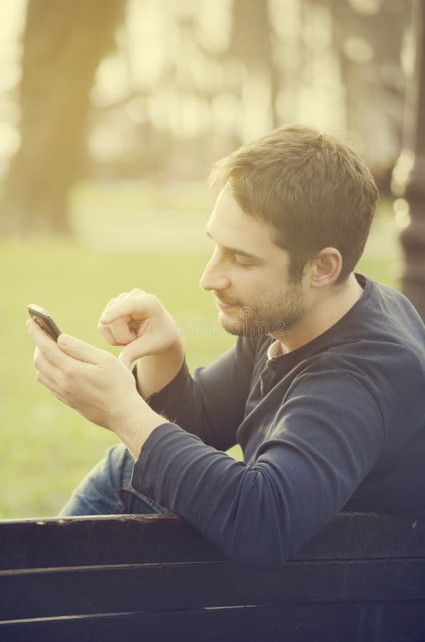 Man texting on phone stock photo. Image of phone, lean - 97072580