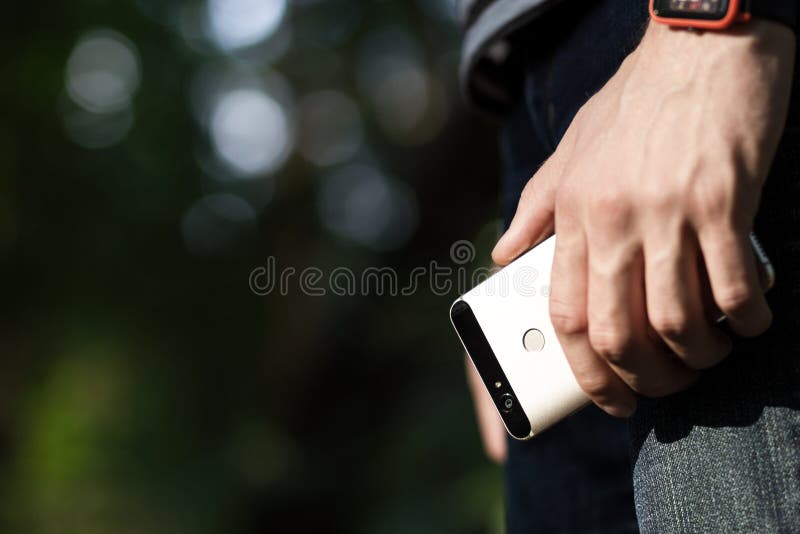 A Man with Smart Watches Holding Big Mobile Smart Phone Stock Photo ...