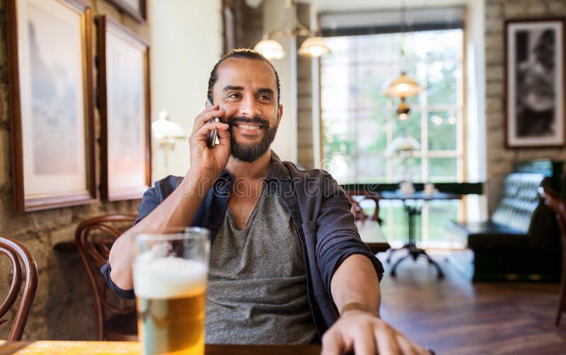 Man with Smartphone and Beer Calling at Bar or Pub Stock Image - Image ...