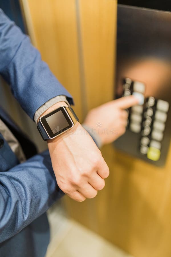 Man with Smartwatch on His Hand Using Elevator Control Panel Stock ...