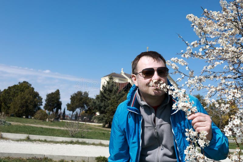 Man Smelling Apple Tree Flower Stock Photo - Image of male, outdoor ...