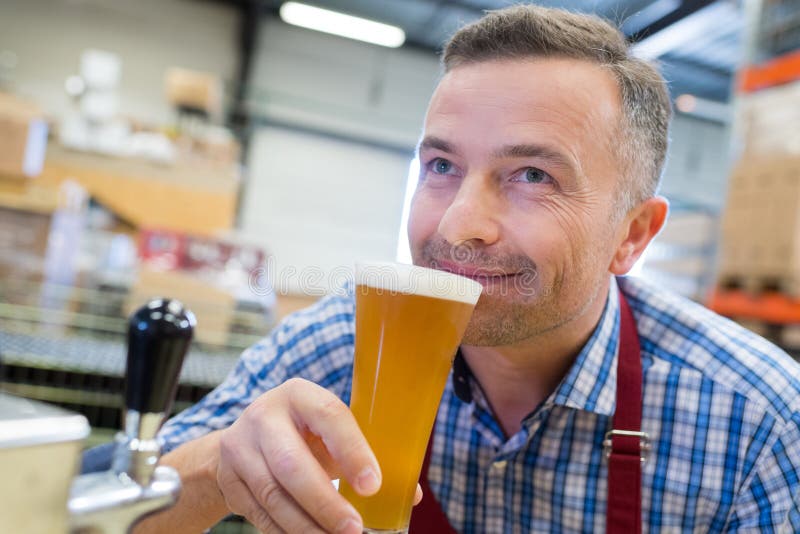Man smelling the beer stock image. Image of satiety - 124188423