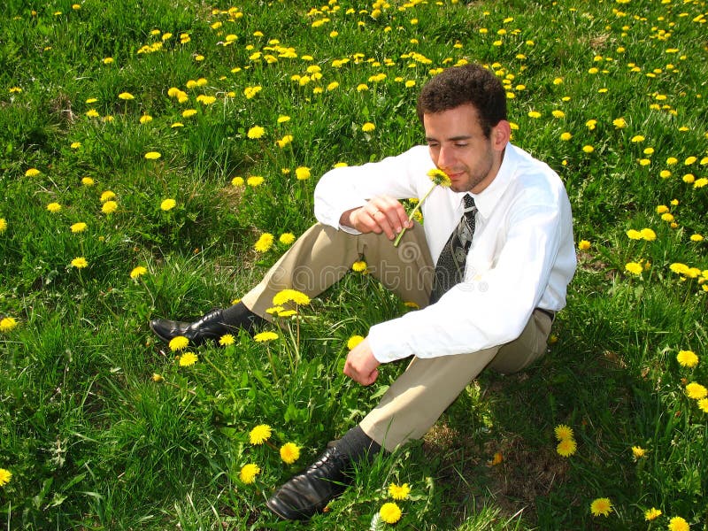 Man Smelling Flowers stock photo. Image of clothing, environment - 7254238