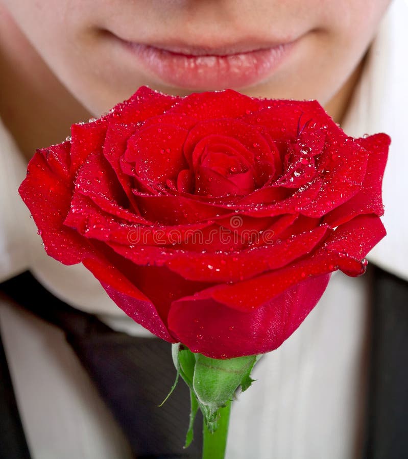 Man smelling a rose stock image. Image of expression - 18085977