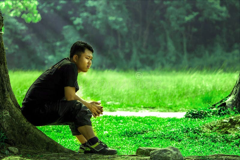 Man sit under the tree stock image. Image of outside - 33976737