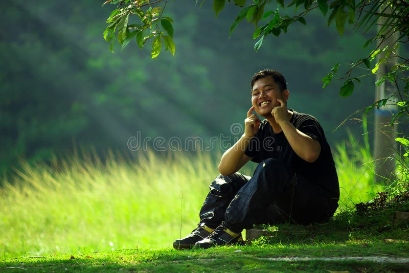 Man sit under the tree stock image. Image of outside - 33976737