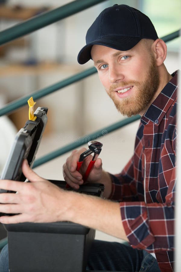 Man Smiles with Holding Tool Box Stock Image - Image of wear ...
