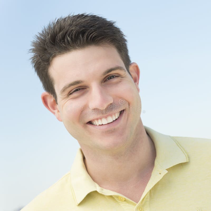 Man Smiling Against Clear Blue Sky Stock Photo - Image of handsome ...
