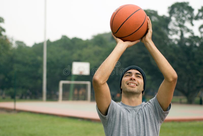 Man Smiling with Basketball - Horizontal Stock Photo - Image of park ...