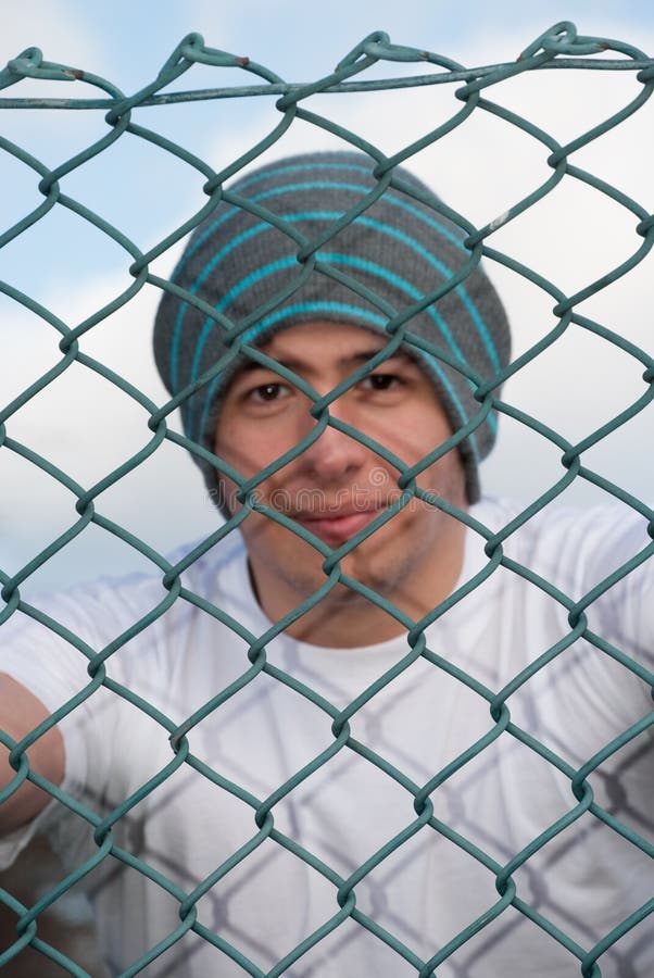 Man smiling behind fence 3 stock image. Image of healthy - 18708683