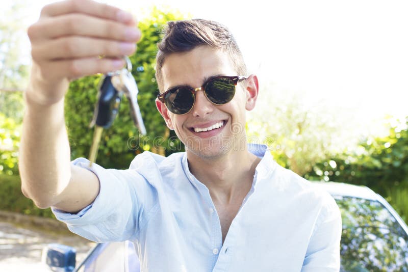 Man Smiling with the Car Keys Stock Image - Image of handing, driver ...