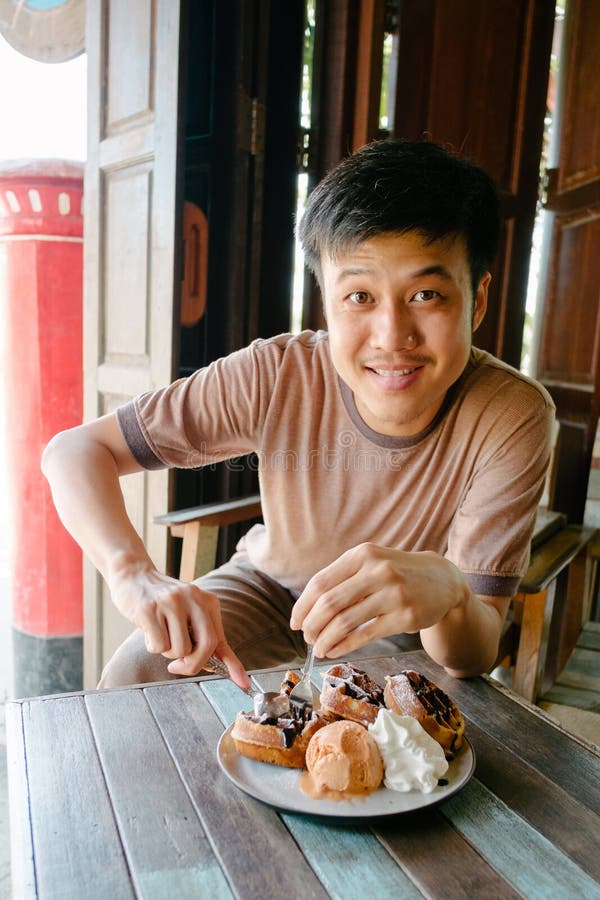 Man Smiling Eating Waffle with Ice-cream at Vintage Cafe Stock Image ...