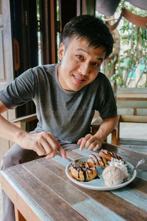 Man Smiling Eating Waffle with Ice-cream at Vintage Cafe Stock Image ...