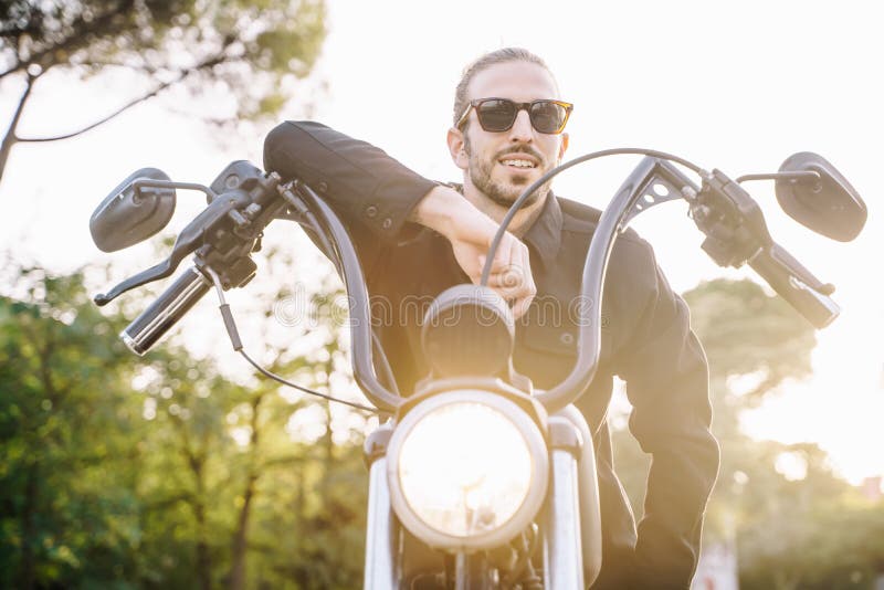 Man Leaning Against Motorcycle Stock Photos - Free & Royalty-Free Stock ...