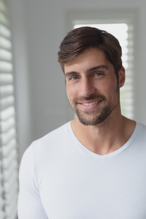 Man smiling at home stock image. Image of clothing, home - 150363641
