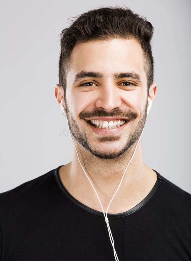 Man Smiling and Listen Music Stock Photo - Image of smile, male: 85288958