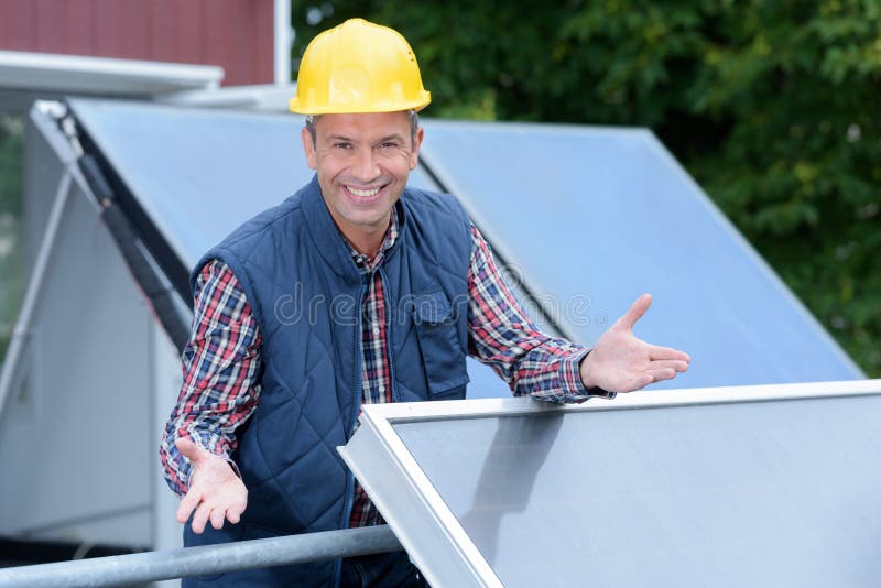 Man Smiling Next To Solar Panel Cell Stock Photo - Image of building ...