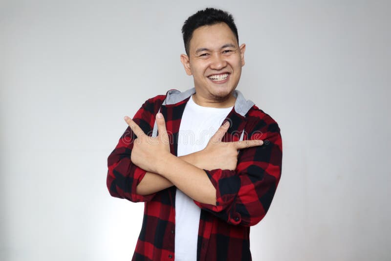 Man Smiling while Pointing To His Side, Right and Left Direction Stock ...