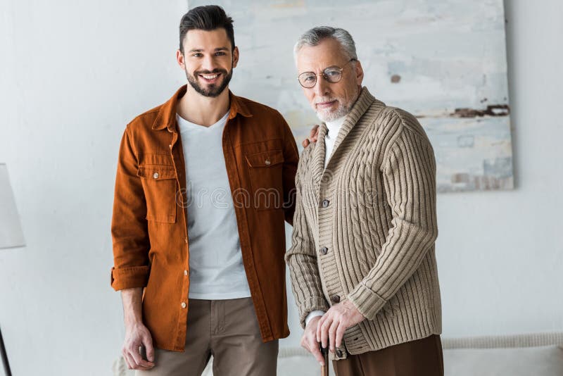 Man Smiling while Standing with Cheerful Senior Father in Glasses Stock ...