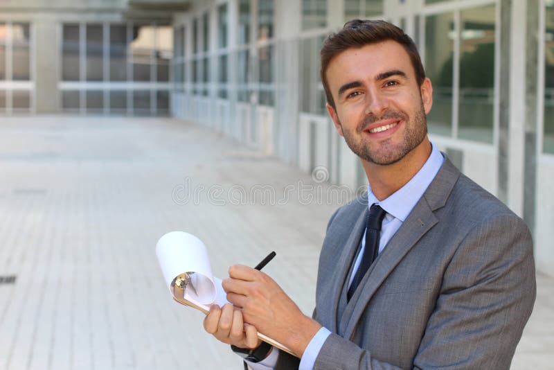 Man Smiling while Taking Notes Stock Photo - Image of attractive, board ...