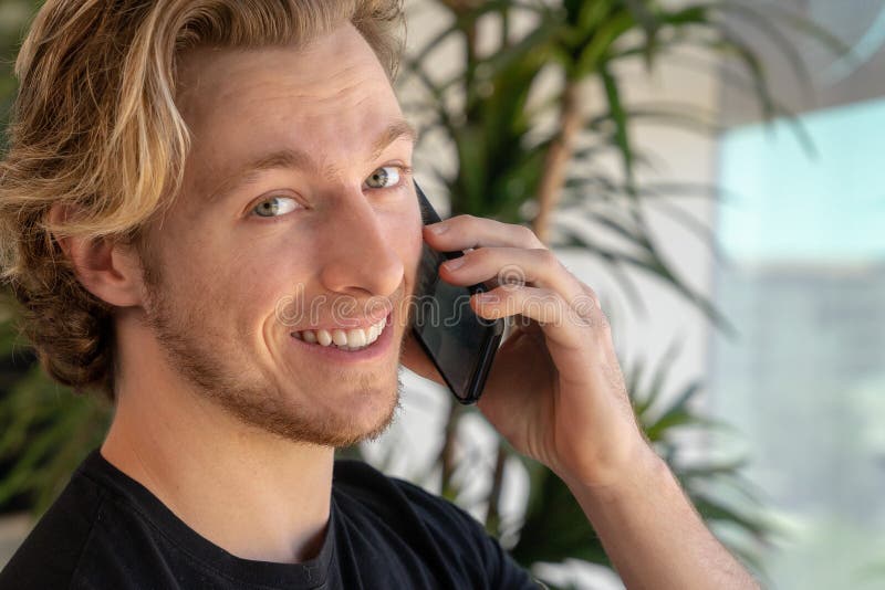 Man Smiling while Talking on Cell Phone Stock Image - Image of ...