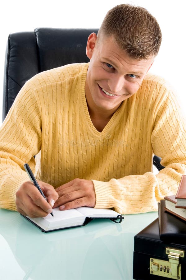 Man smiling while writing stock image. Image of work, posing - 7419983