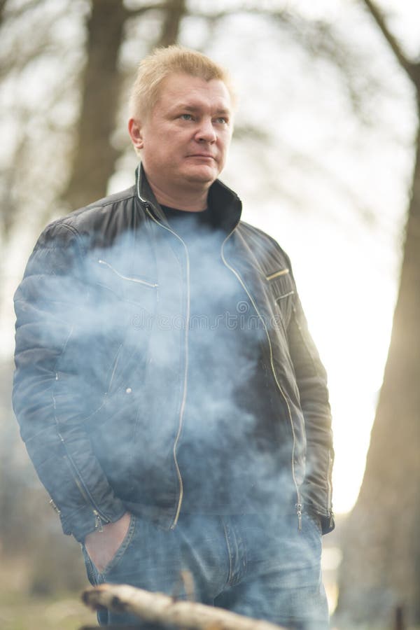 Man in the Smoke from the Fire Stock Photo - Image of breakdown, people ...