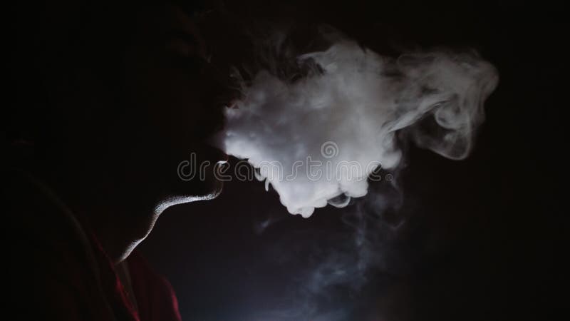 Man smokes in the dark stock image. Image of black, nargile - 77508509
