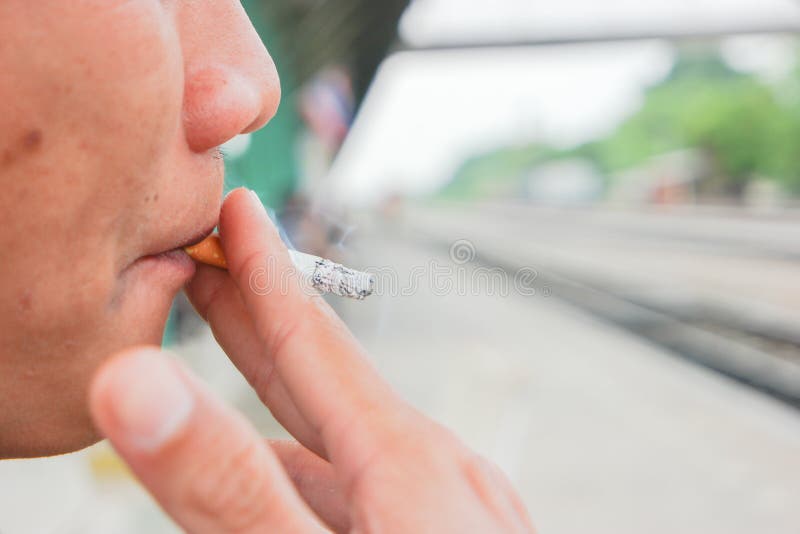 Man smoking cigarette stock image. Image of smokeless - 71809649