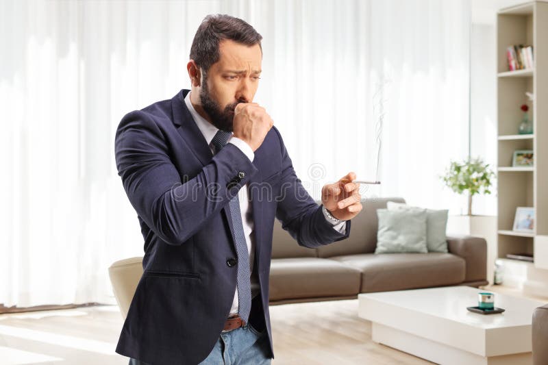 Man Smoking and Coughing at Home in a Living Room Stock Image - Image ...