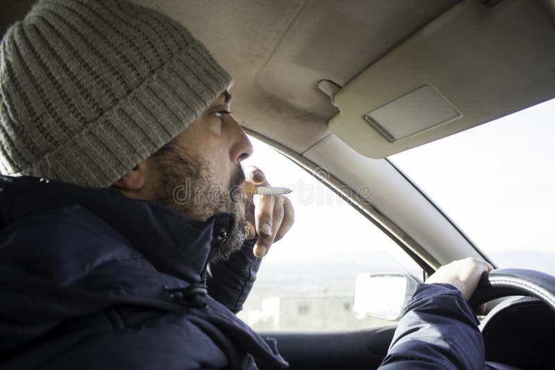 Man smoking driving stock image. Image of driving, people - 84732635