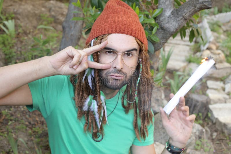 Man Smoking a Gigante Cigarette Stock Photo - Image of high, danger ...