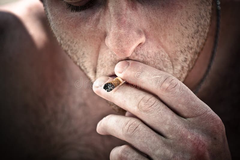 Man smoking hashish joint stock image. Image of hash - 41683679