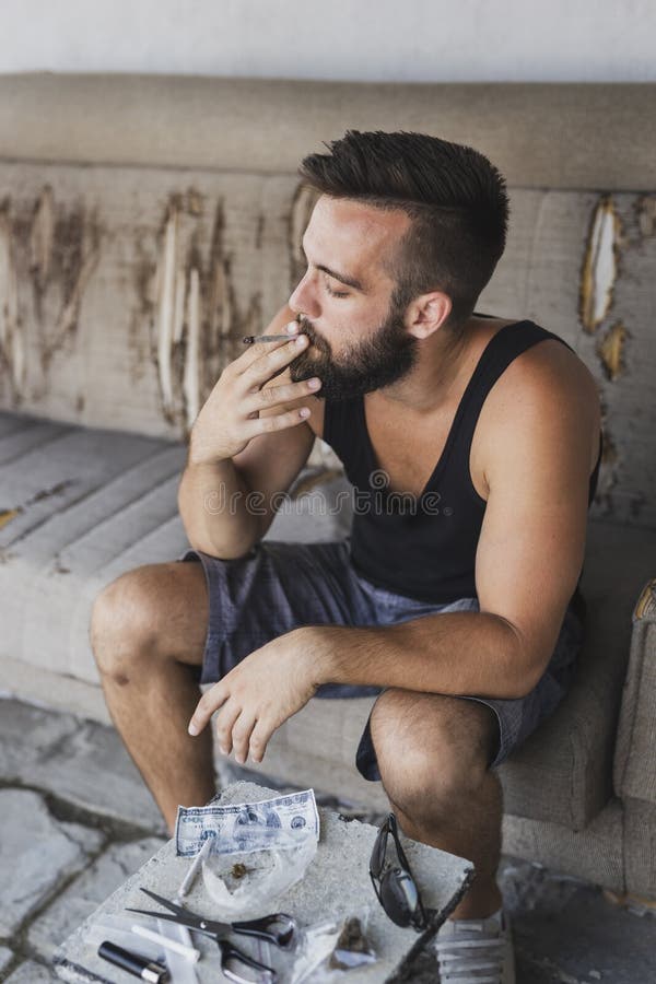 Man smoking marijuana stock photo. Image of sitting - 138678570