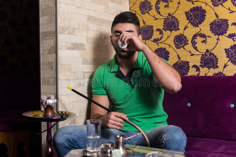 Man Smoking Shisha And Drinking Coffee Stock Image Image Of Acharcoal