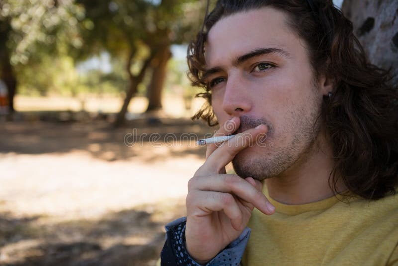 Man Smoking Weed in the Park Stock Image - Image of habit, sitting ...