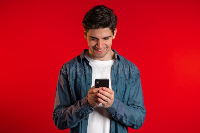 Man Sms Texting Using App on Smartphone. Handsome Young Guy Surfing ...