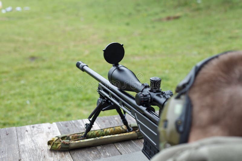 A Man Sniper Prepares To Shoot at the Target. Stock Photo - Image of ...