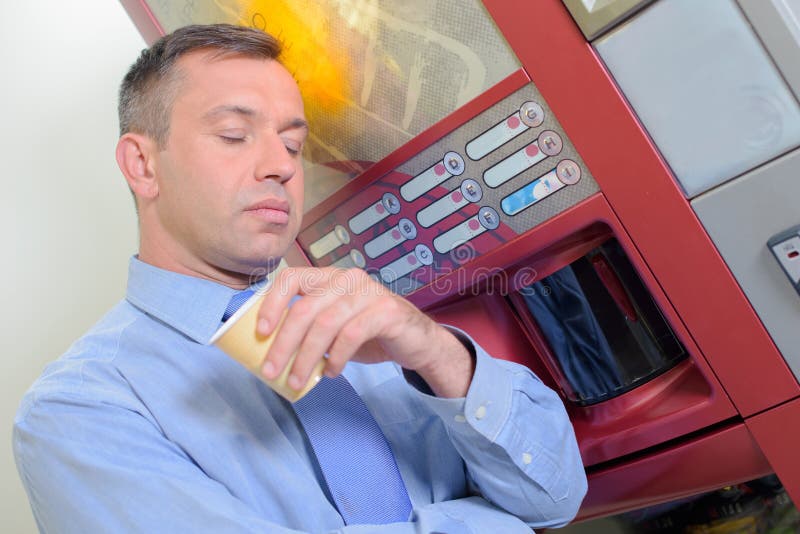 Man Snoozing by Hot Drinks Vending Machine Stock Image - Image of ...