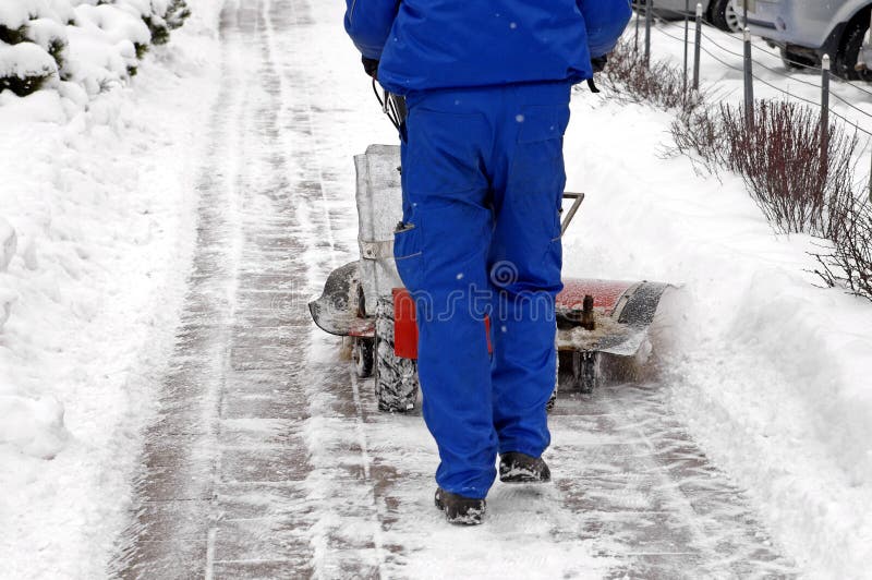Man and a Snow Blowing Machine Stock Photo - Image of uniform ...
