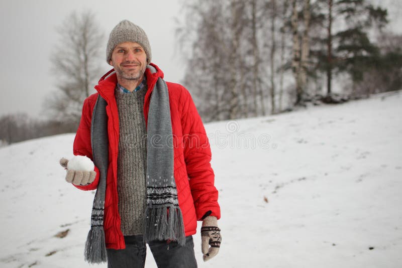 Man with snowball stock image. Image of copy, jeans - 105135125