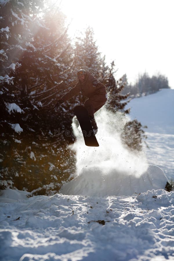 Man snowboarder jumping stock image. Image of posing - 23997929