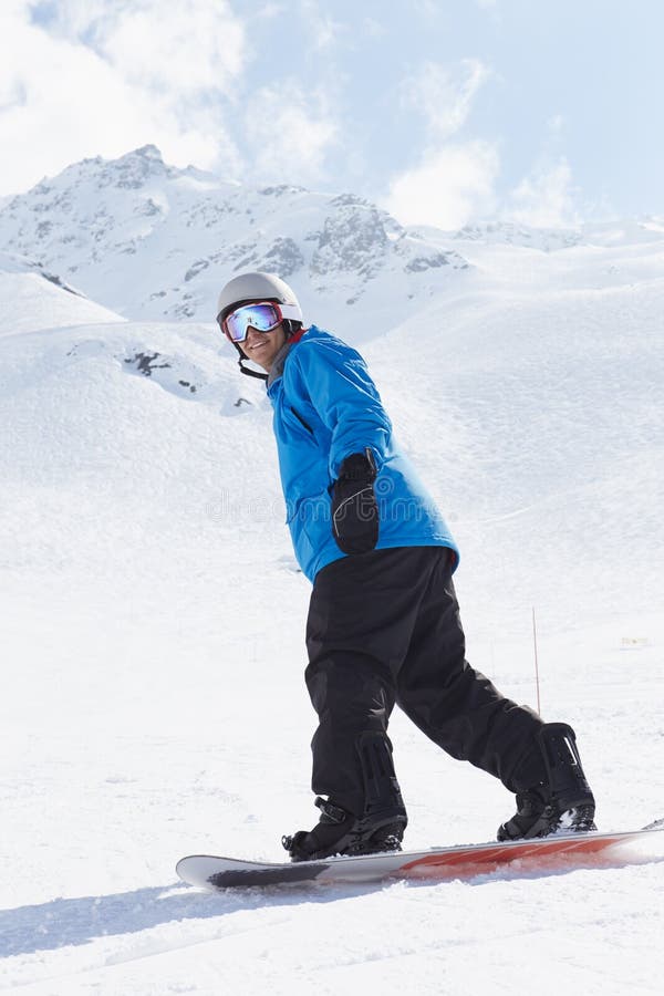 Man Snowboarding on Ski Holiday in Mountains Stock Image - Image of ...
