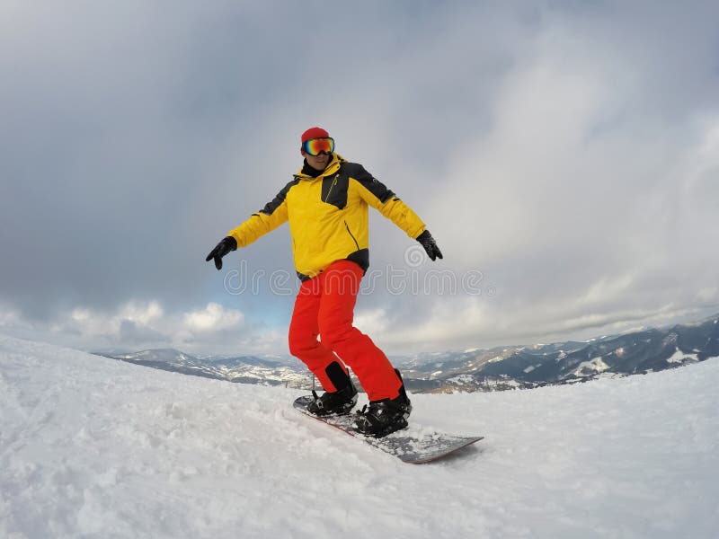 Man Snowboarding at Ski Resort. Winter Vacation Stock Image - Image of ...