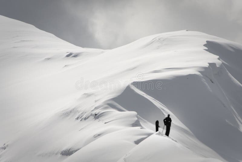 Man on a snowy ridge stock image. Image of snow, ridge - 50987107